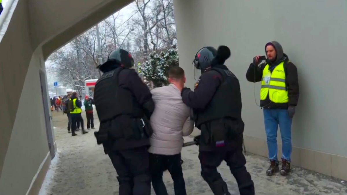 Russian Police Use Shock Baton On Man Being Detained