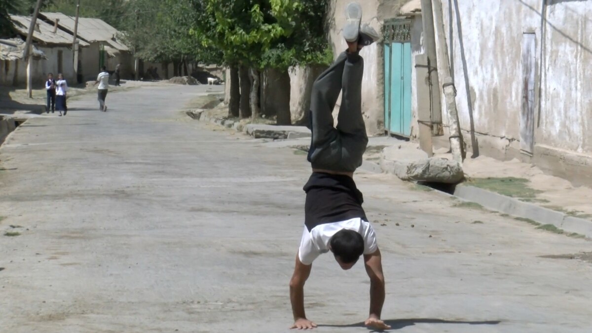 Tajik Polio Victim Finds A Better Way To Walk, Hands Down