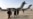 People line up to board a military aircraft as they are evacuated from Kabul. (file photo)