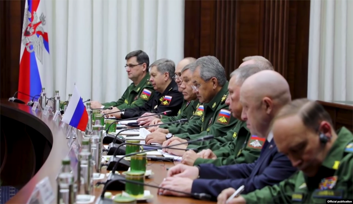 Video Places Putin-Connected Oligarch At Top-Level Military Talks