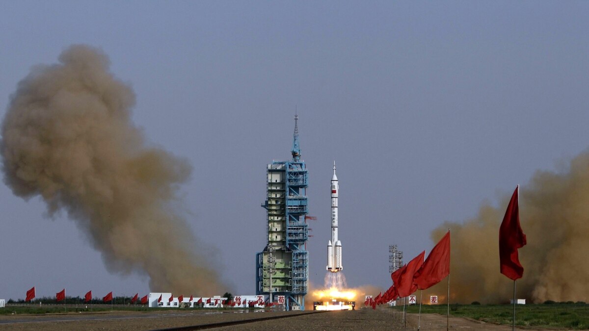 Chinese Space Capsule Docks With Lab